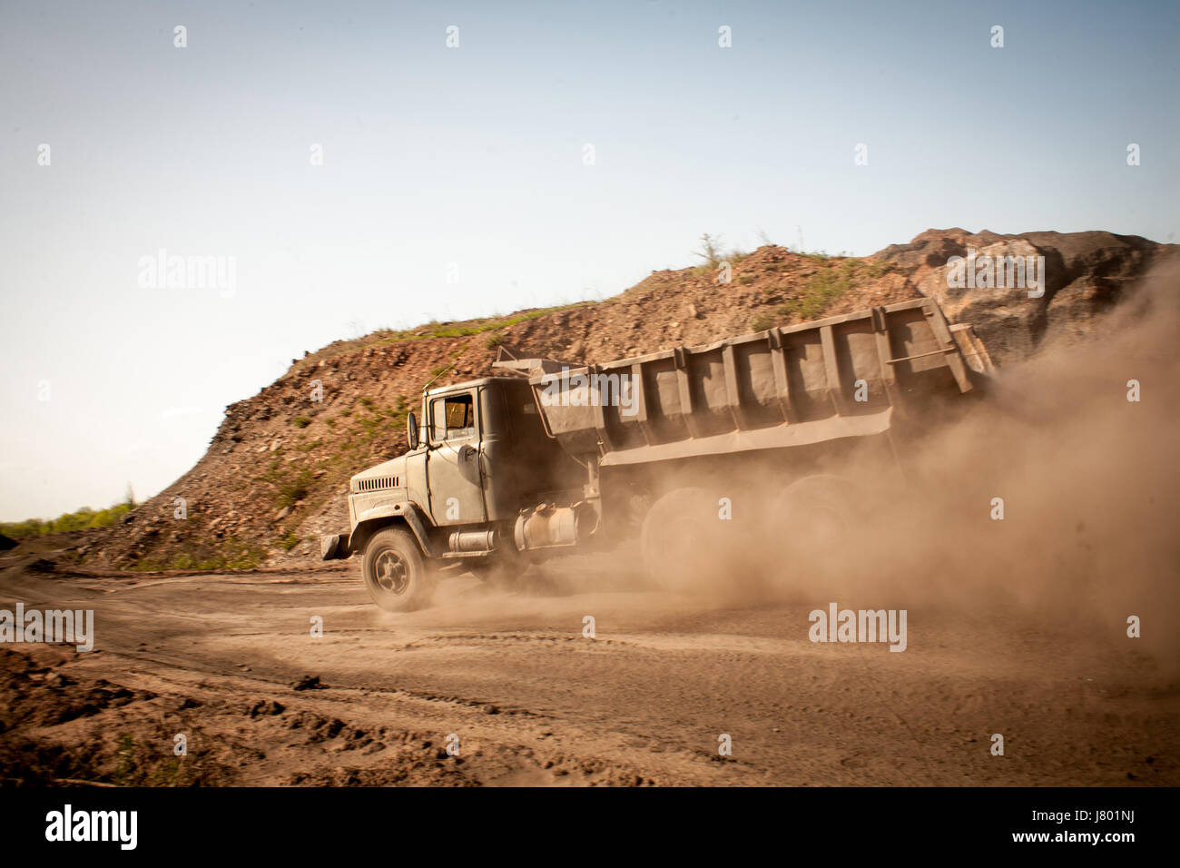 Truck carries a load in the quarry full body of rubble and building ...