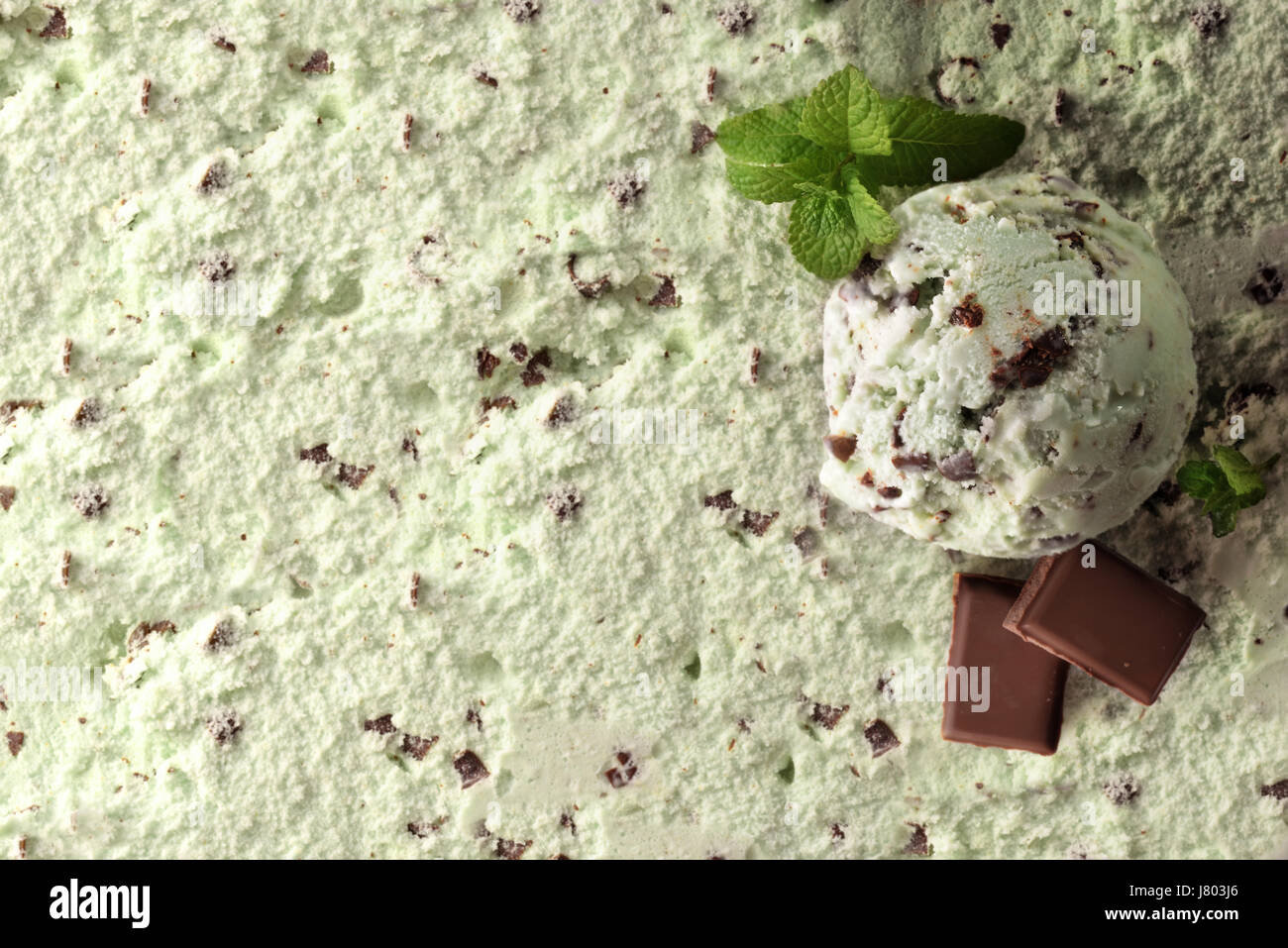 Ice cream flavored mint choco texture background with ball. Garnished ...