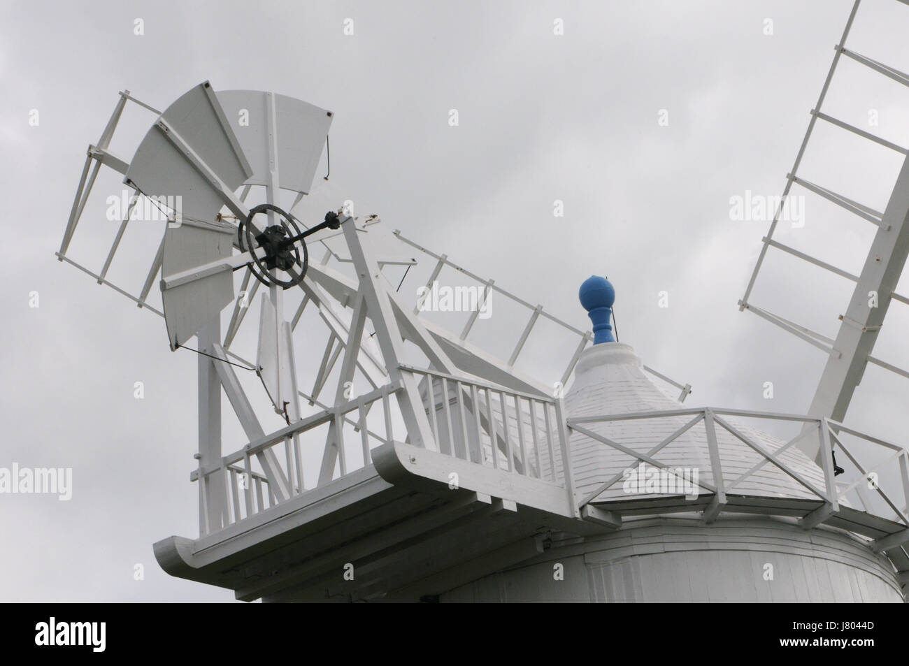 The cap, fantail and sails of a tower windmill. Holt, Norfolk, UK Stock ...