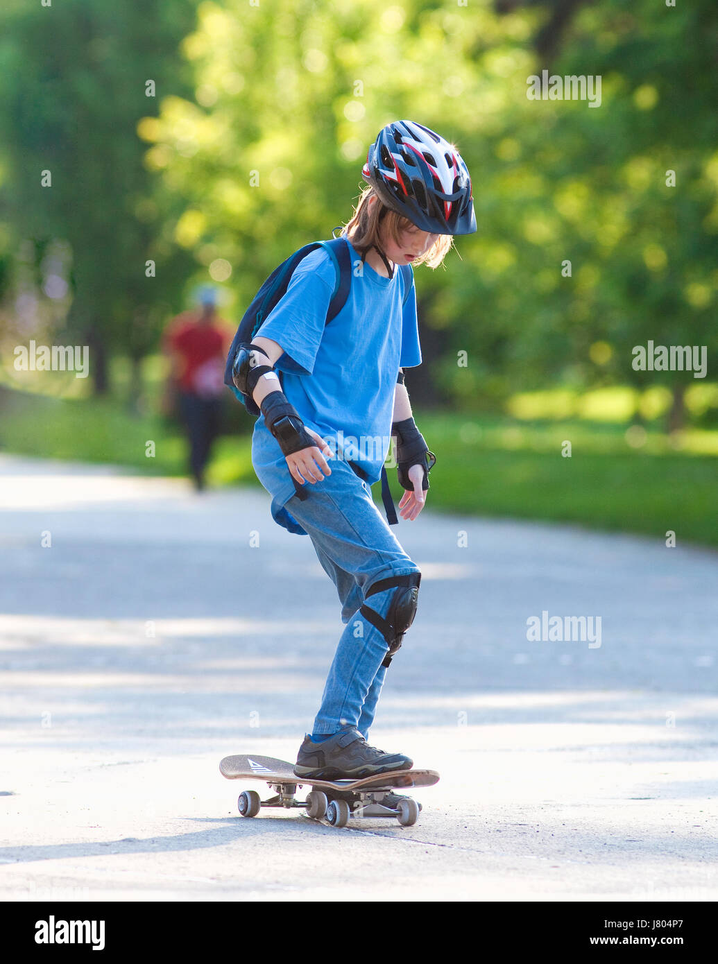 Skateboarding - Boy with Blond Hair Learning to Skateboard Stock Photo ...