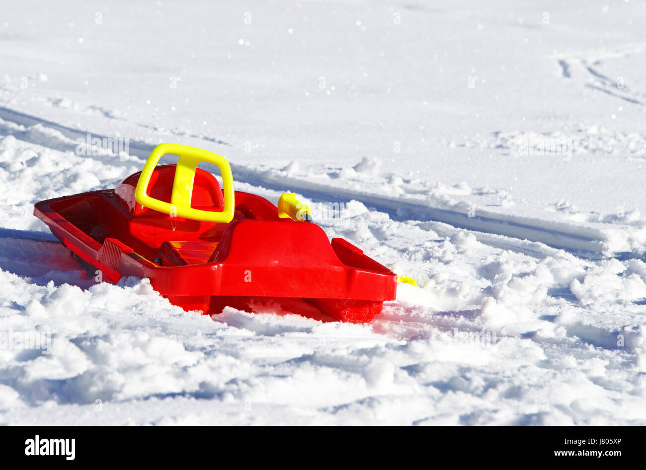 red sled in snow Stock Photo - Alamy