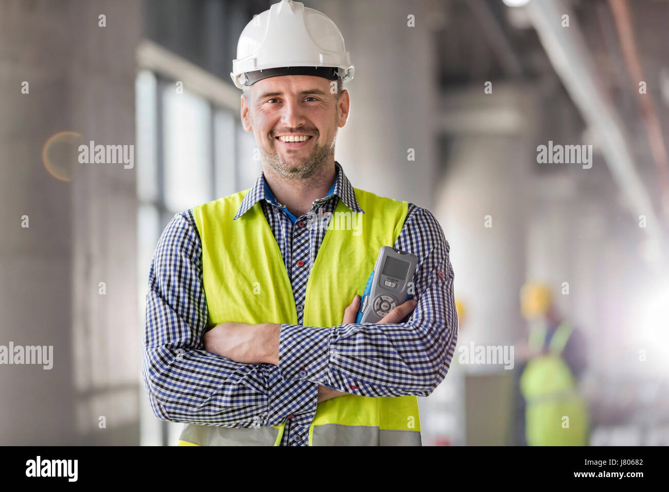 Portrait smiling engineer at construction site Stock Photo - Alamy