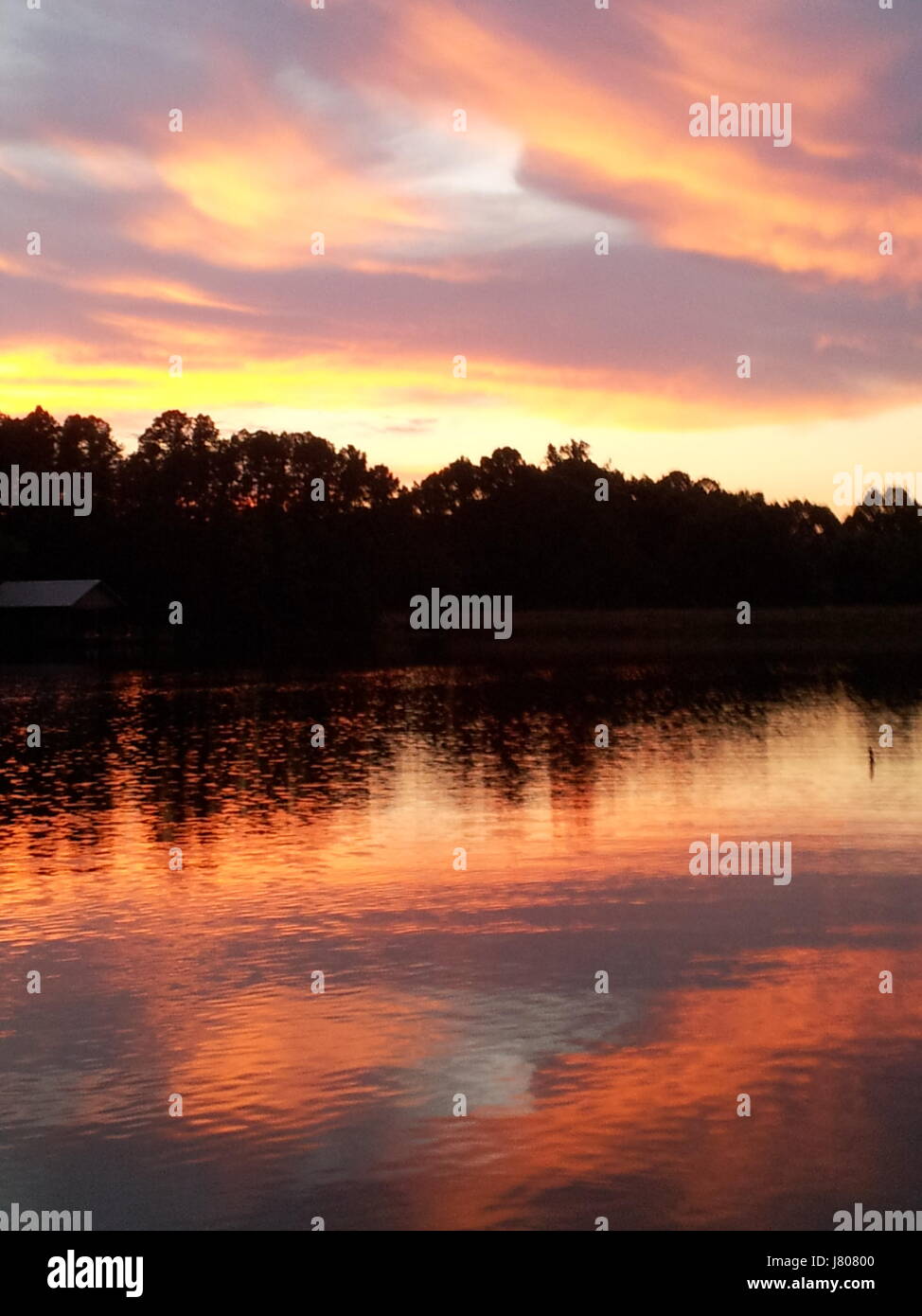 Burning Sunset on Lake Stock Photo - Alamy