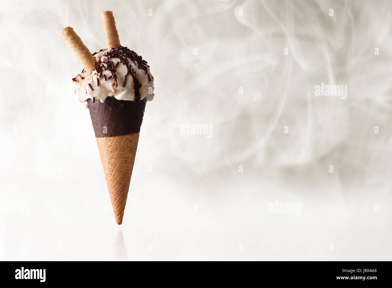 Ice cream cone flavored cream choco. Elevated on reflective table and ...