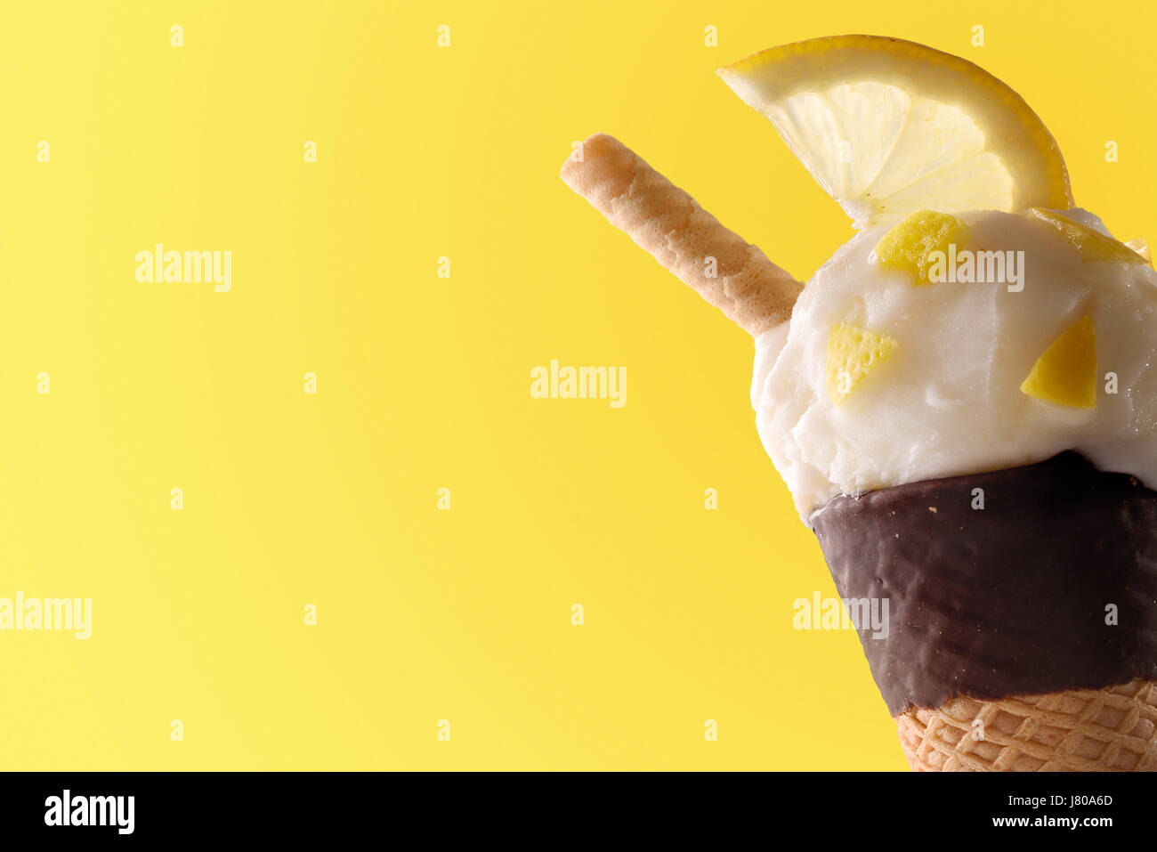 Ice cream cone flavored lemon close up. Garnished with lemon pieces ...