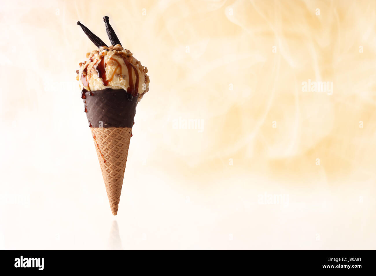 Ice cream cone flavored vanilla. Elevated on reflective table and ...