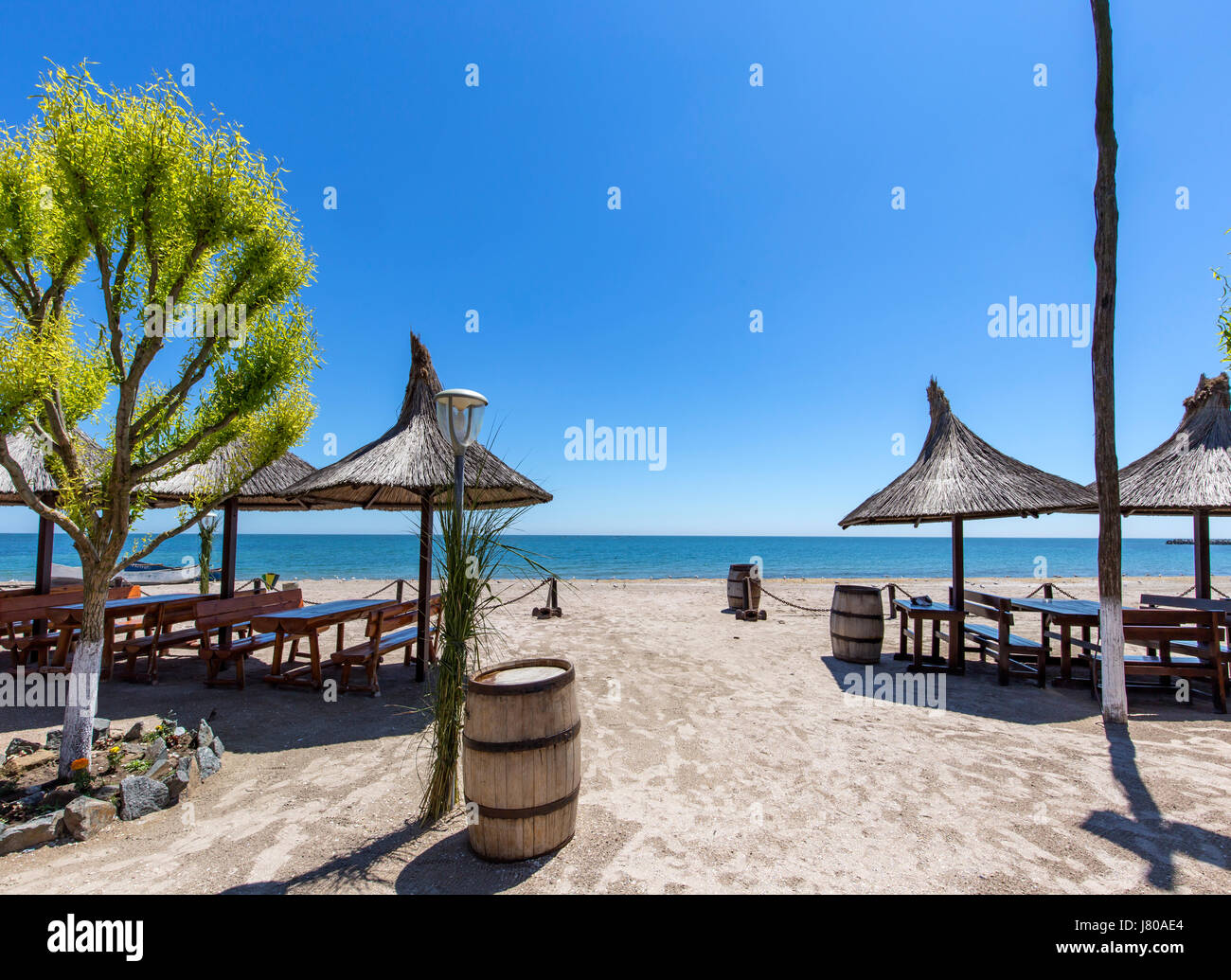 Wide sand beach with umbrellas on Black Sea in Romania Stock Photo - Alamy