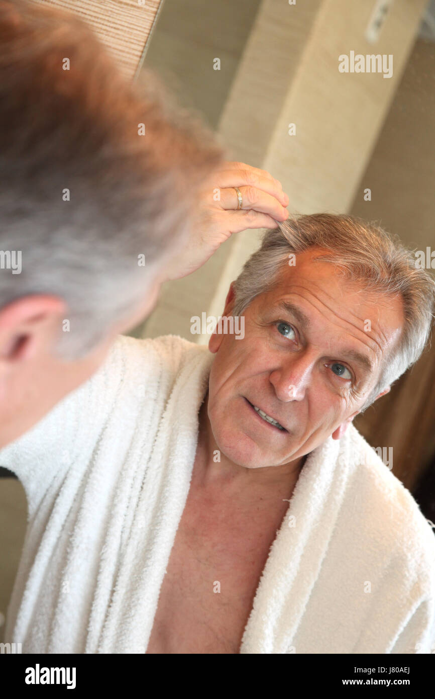 bathrobe mirror concern worried worry anxiety anxious solicitous ...