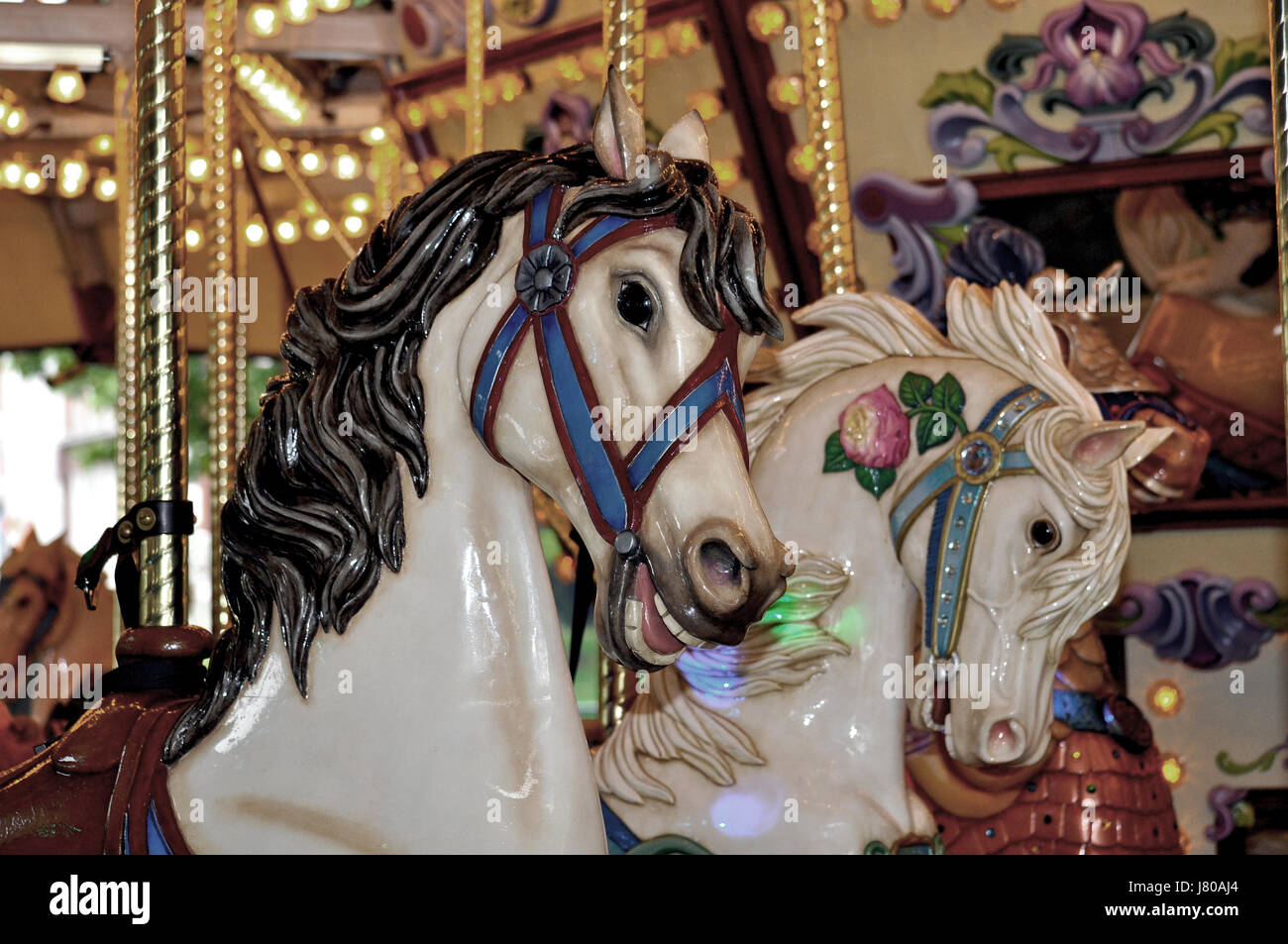 Two pretty carousel horses at the fair Stock Photo - Alamy