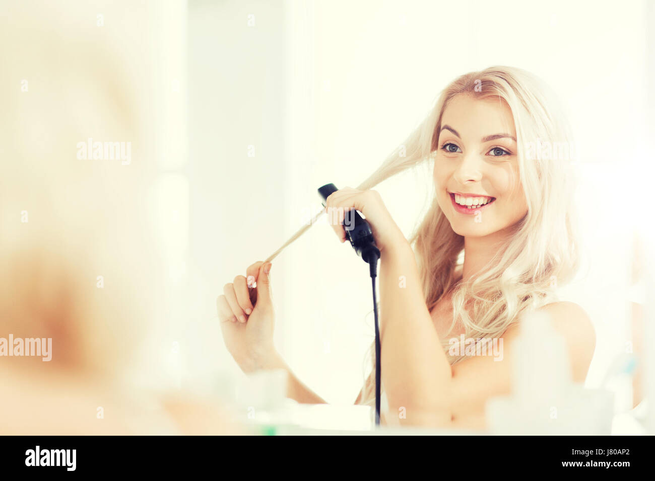 Woman doing hairdo hi-res stock photography and images - Alamy