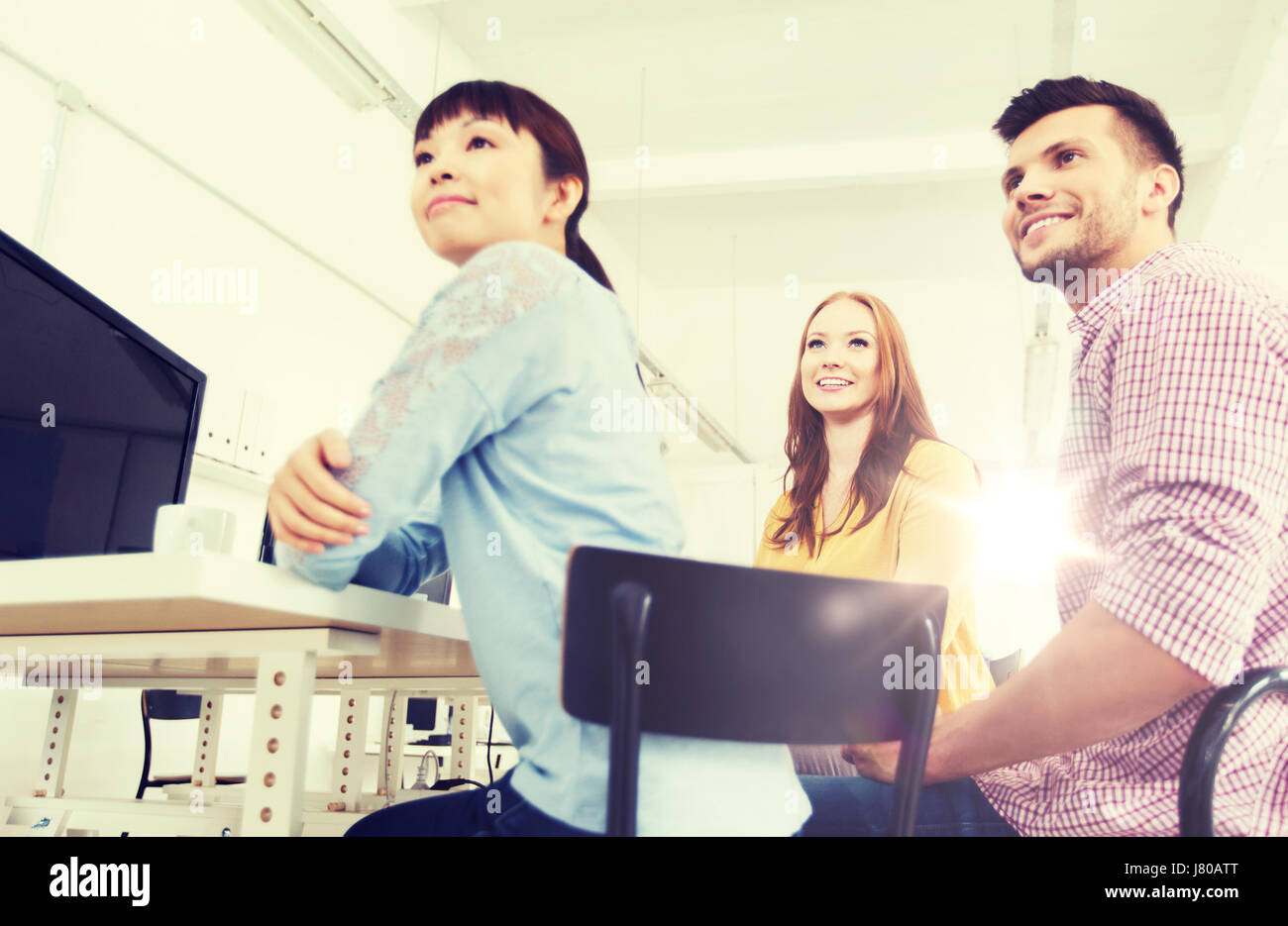 happy creative team drinking coffee at office Stock Photo - Alamy