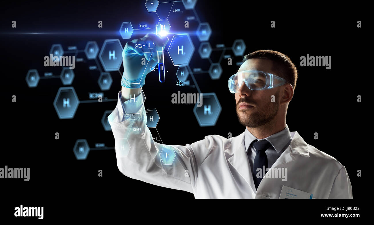 scientist with test tube and chemical formula Stock Photo - Alamy