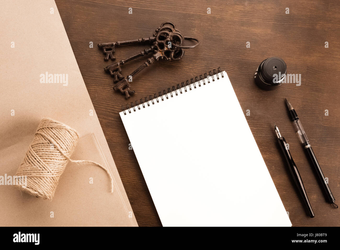 Top view of fountain pen, drawing album, water brush pen, ink and old ...