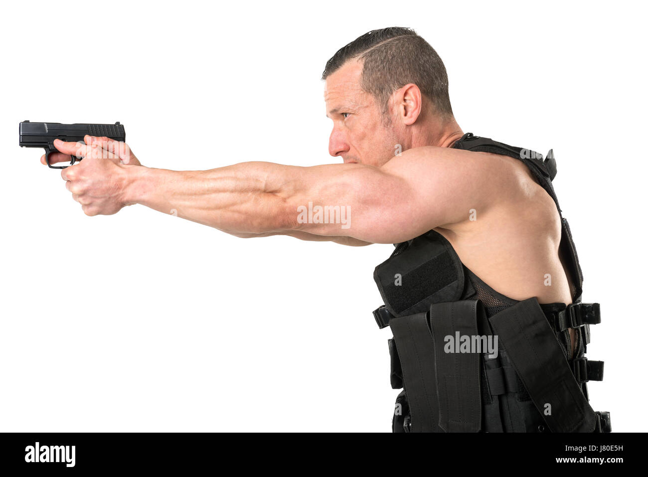 Man with tactical vest and gun isolated in white Stock Photo - Alamy