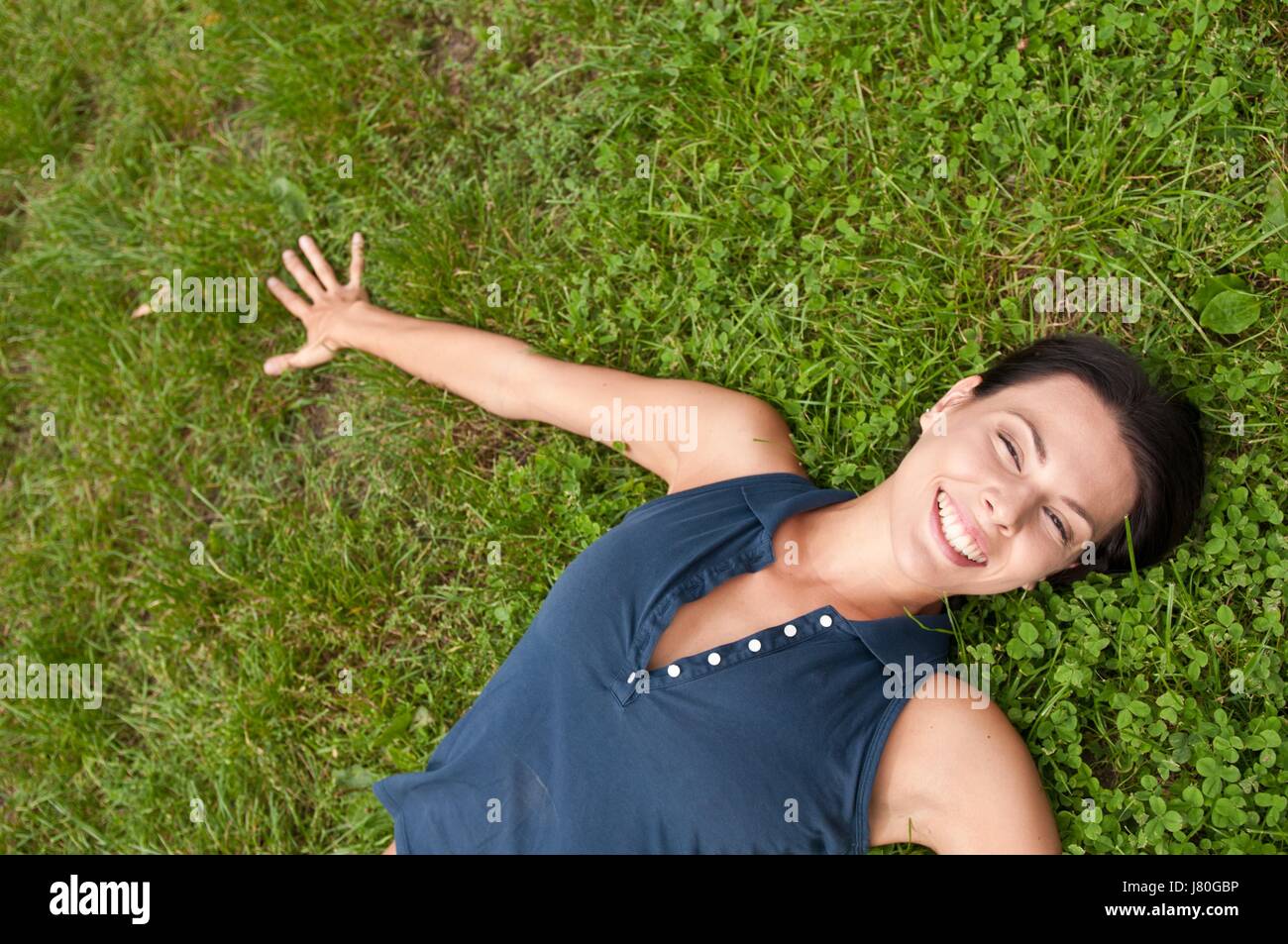 woman beautiful beauteously nice person lie lying lies down delighted ...