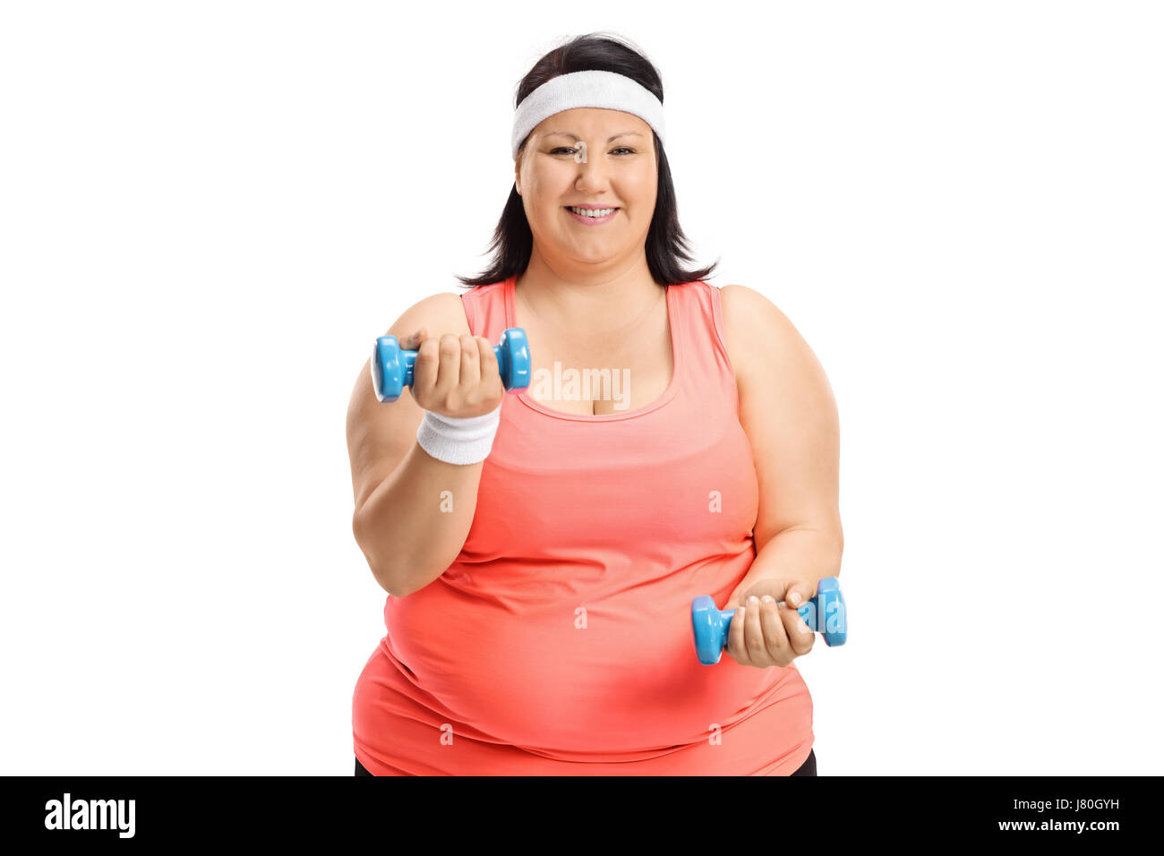 Overweight woman exercising with small dumbbells and smiling isolated ...