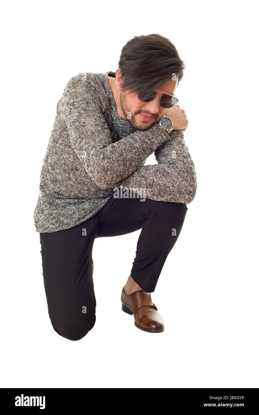 Man on knees, isolated over white background Stock Photo - Alamy