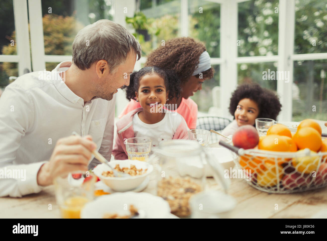 Multi ethnic children couple eating hi-res stock photography and images ...