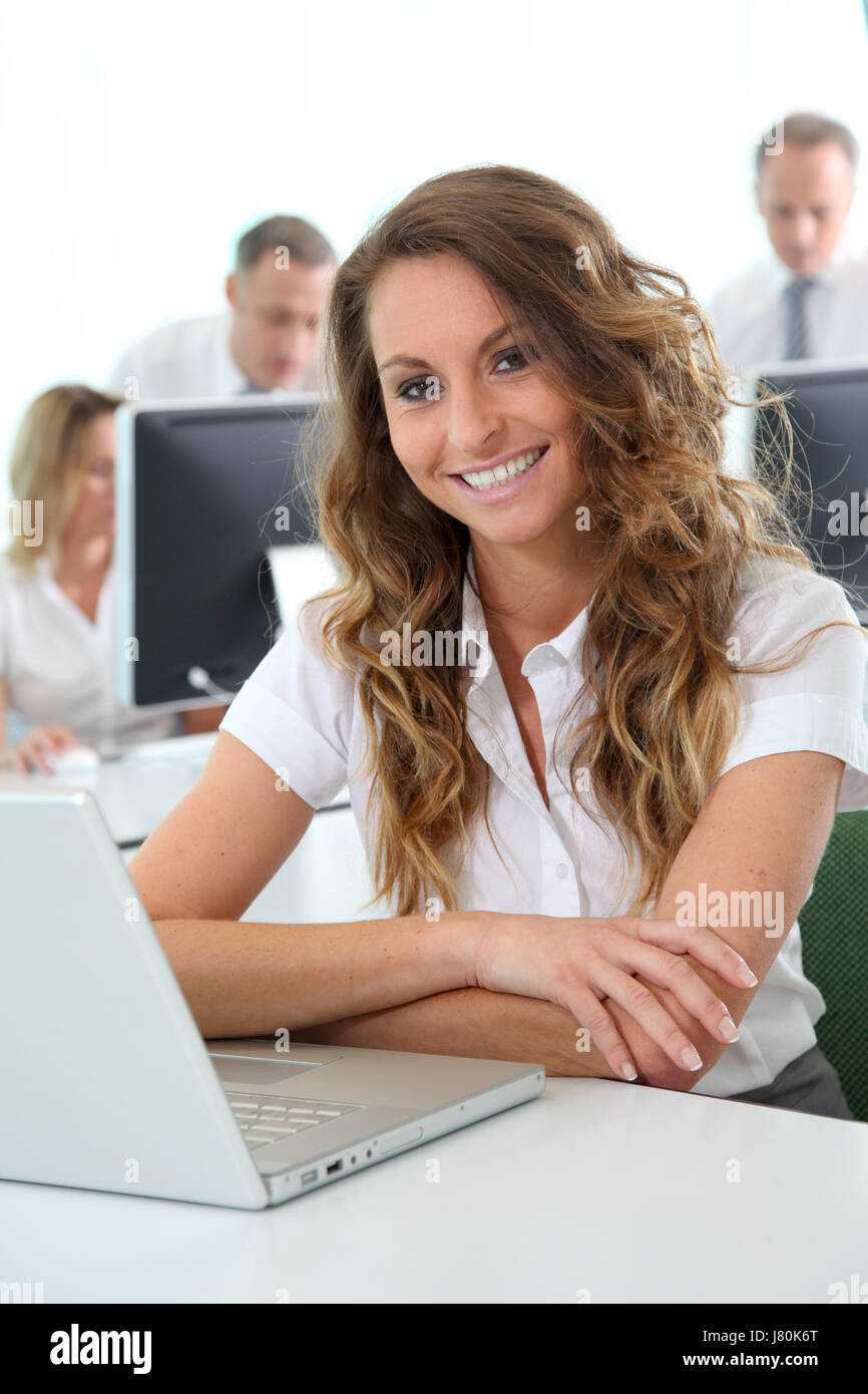 woman office laptop notebook computers computer laugh laughs laughing ...