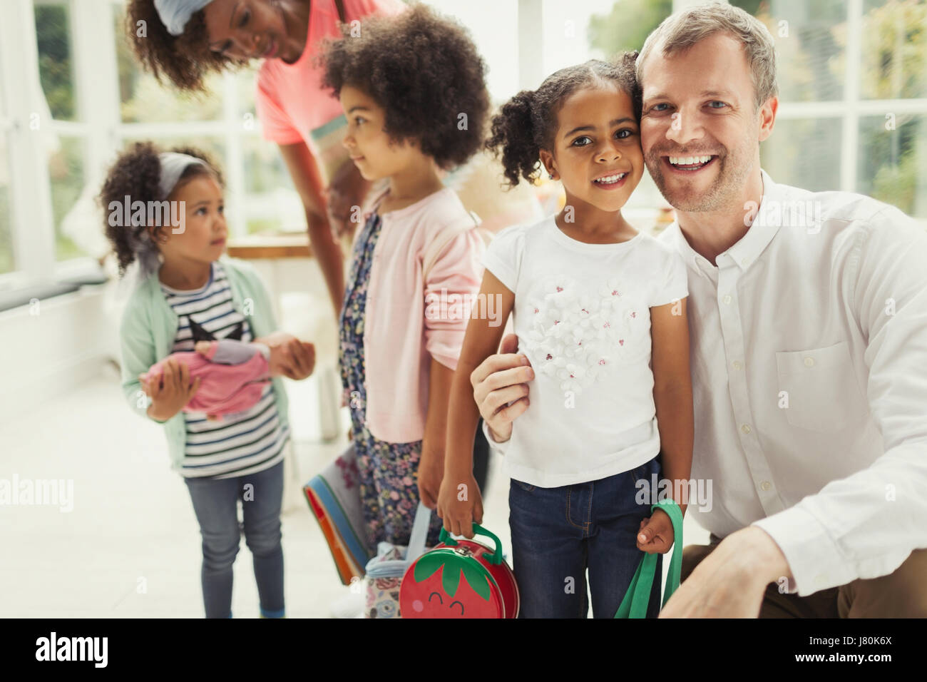 Portrait smiling multi-ethnic father and daughter Stock Photo - Alamy