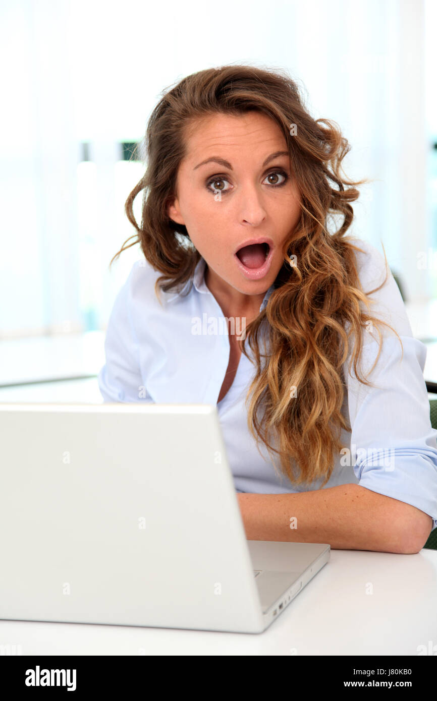 woman office laptop notebook computers computer laugh laughs laughing ...