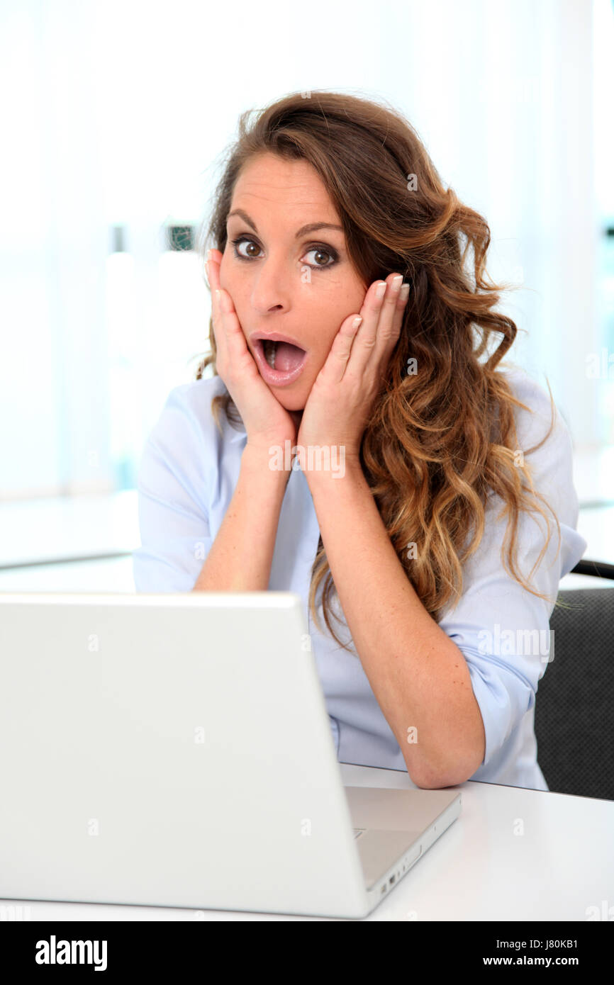 woman office laptop notebook computers computer laugh laughs laughing ...