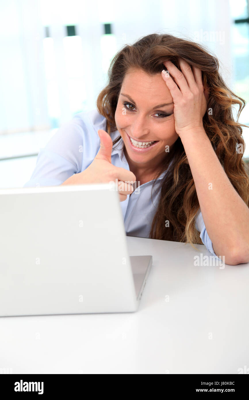 woman office laptop notebook computers computer laugh laughs laughing ...