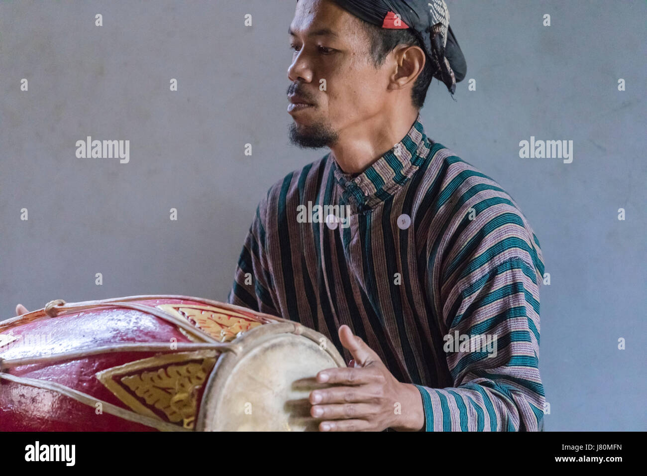 man playing traditional gamelan drums in Magelang, Borobudur, Java ...