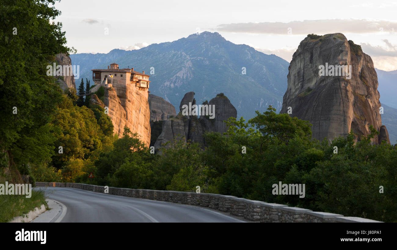Road and scenic sunset view of the Orthodox Monastery of Rousanou (St ...