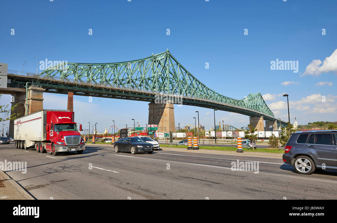 MONTREAL, QUEBEC, CANADA - 18 MAY 2017: Traffic on street under the ...