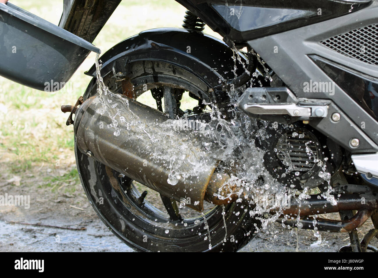 Washing scooter. Throwing water Stock Photo - Alamy