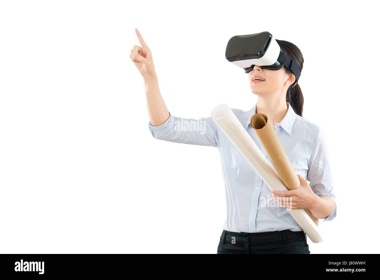 young asian architect woman holding design paper scroll experience VR ...