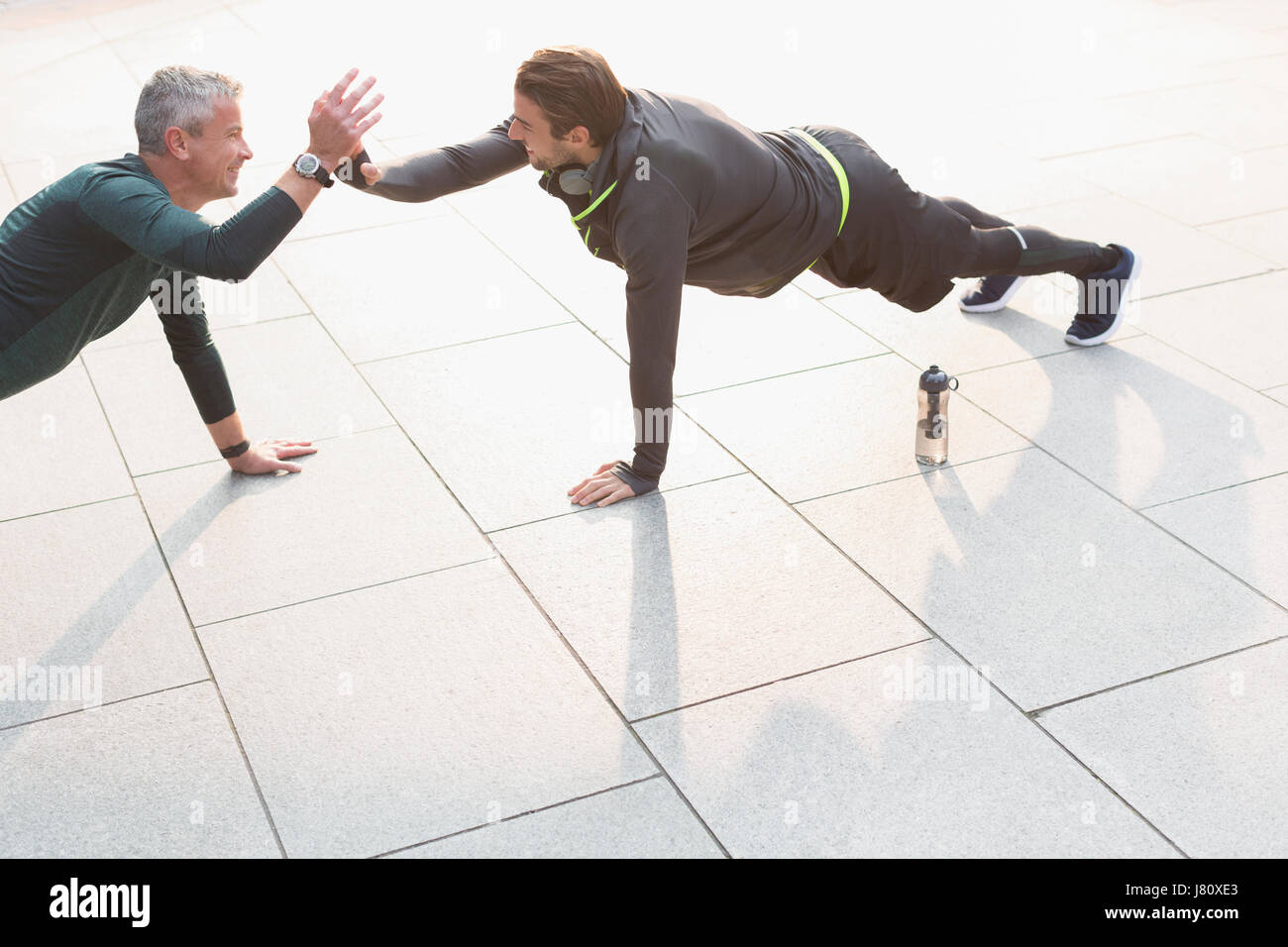 Five young people doing a high five hi-res stock photography and images ...