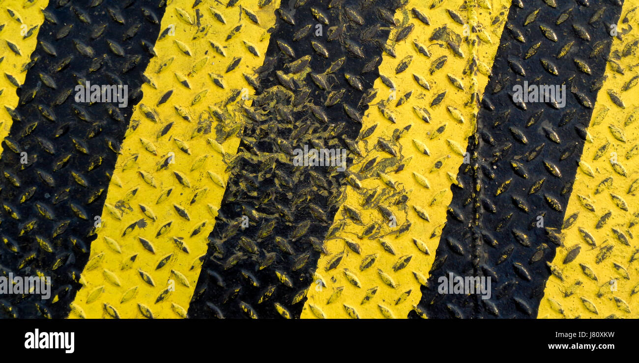 Black and yellow line paint on non-slip metal background Stock Photo ...