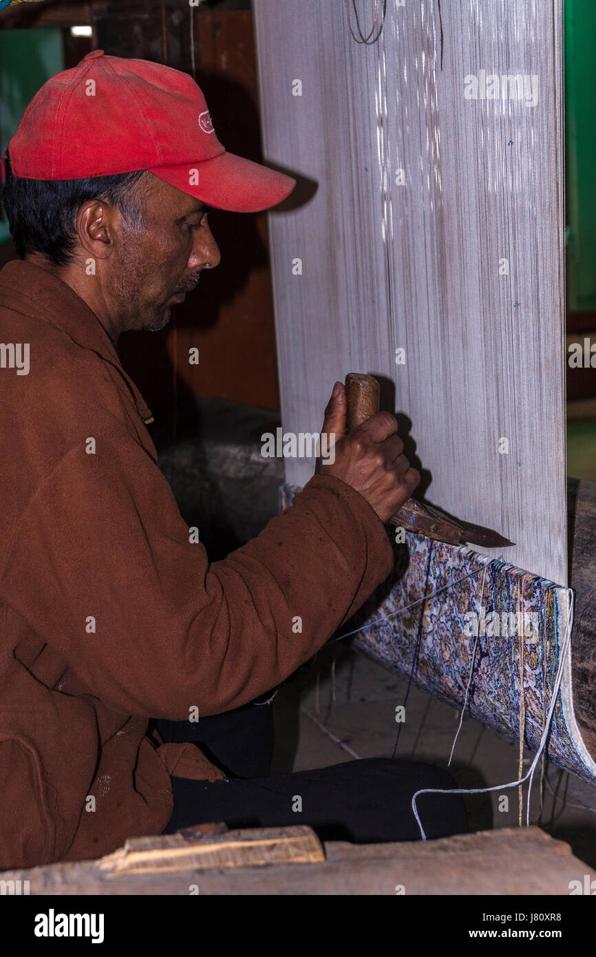 Demonstration of traditional hand-weaving of silk carpet Stock Photo ...