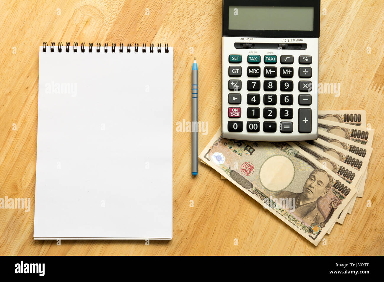 White note book place on wooden table background Stock Photo - Alamy