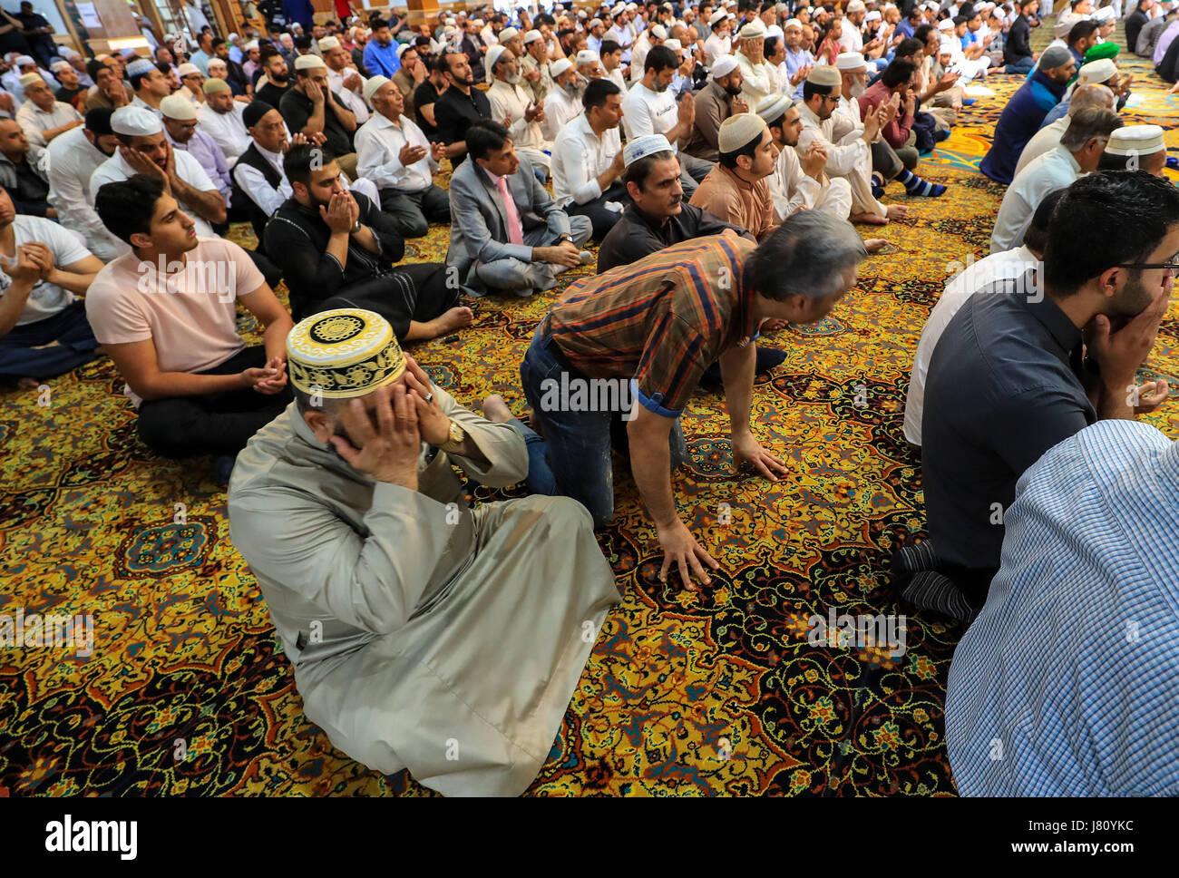 Men attend friday prayers hi-res stock photography and images - Alamy