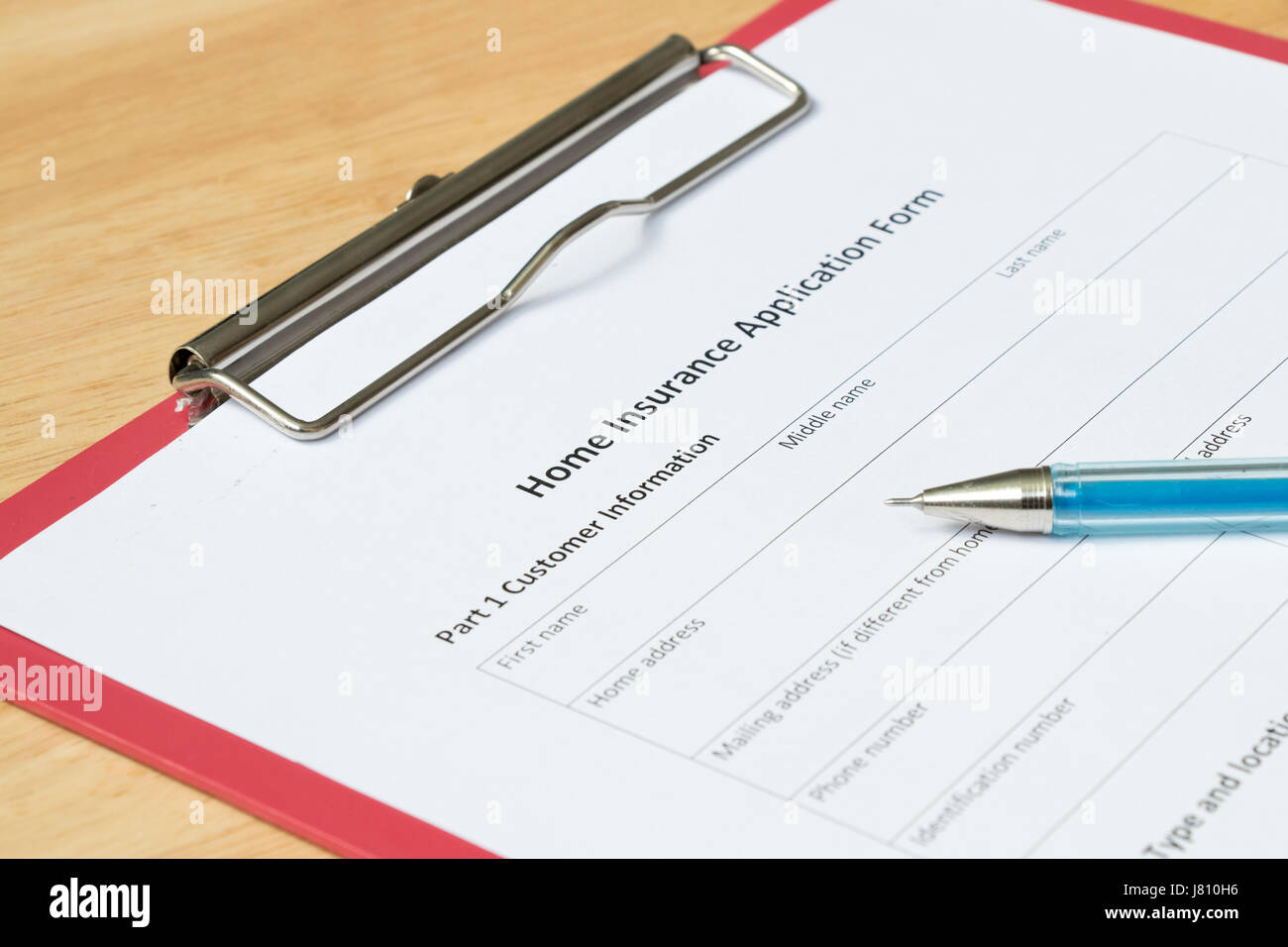 Home insurance application form with red file on wooden table Stock ...