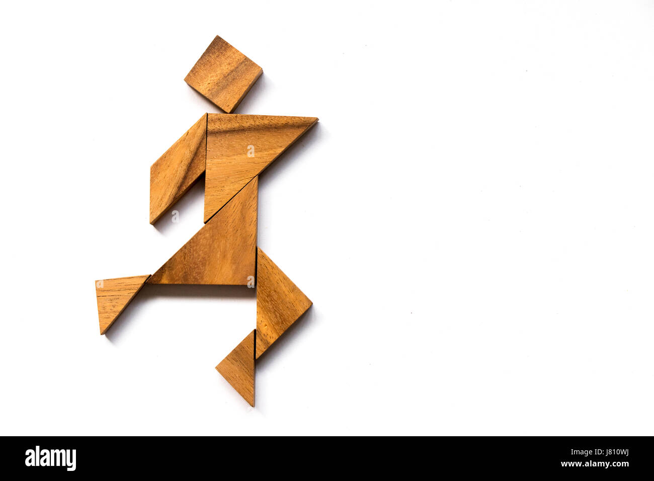 Wooden tangram as happy man shape on white background (Concept as ...
