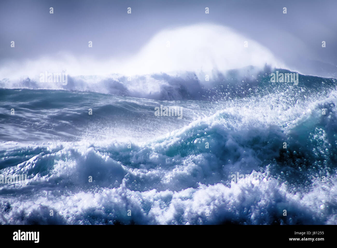 Impressive storm on Pacific coast. Wind blows spray from wave crest ...