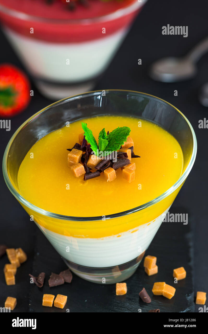 Mango and strawberry panna cotta - traditional Italian dessert Stock ...