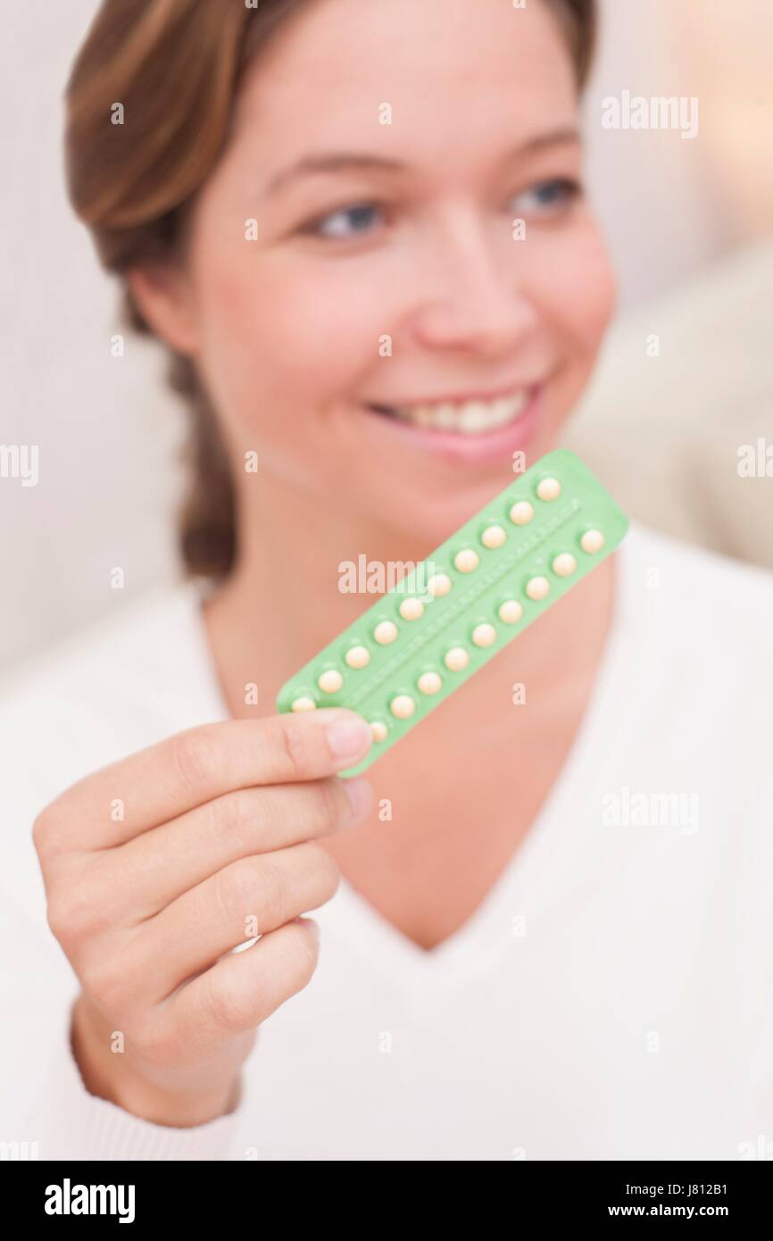 Woman and pill and contraception hi-res stock photography and images ...