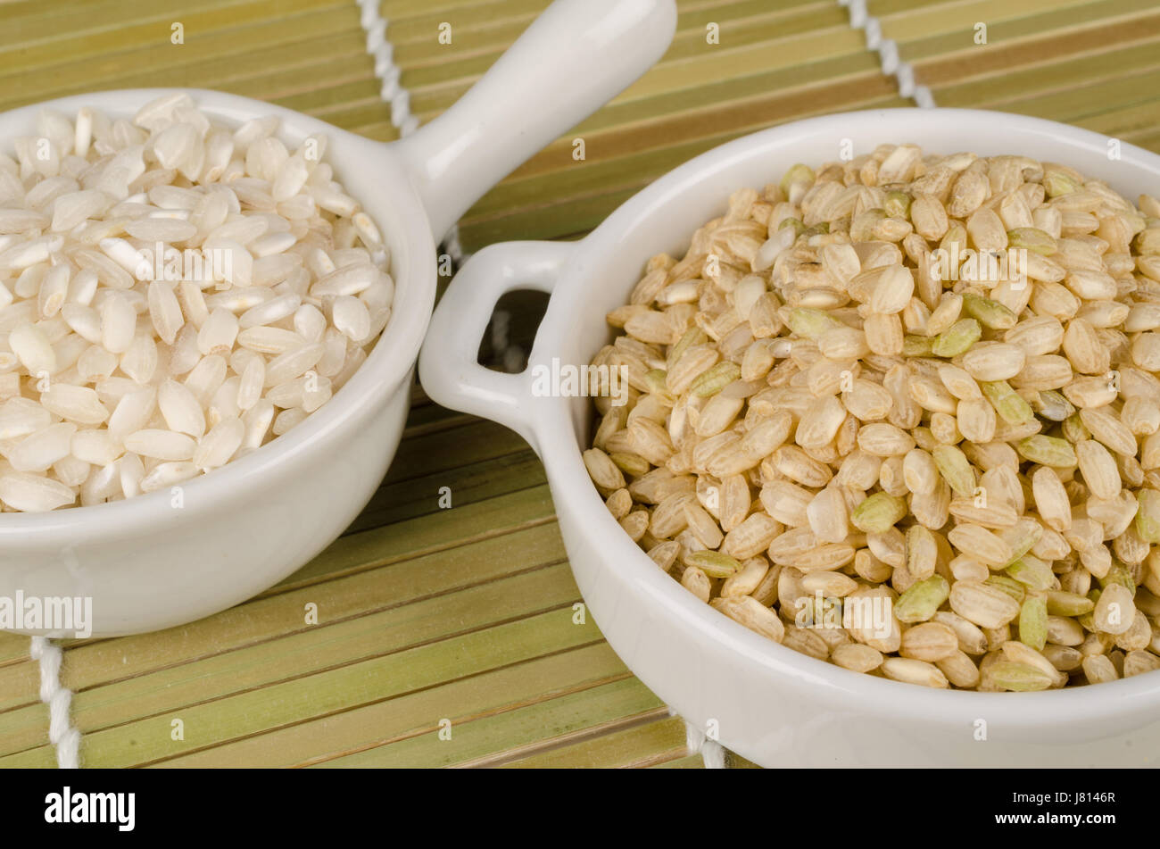 Whole and long grain white rice Stock Photo - Alamy