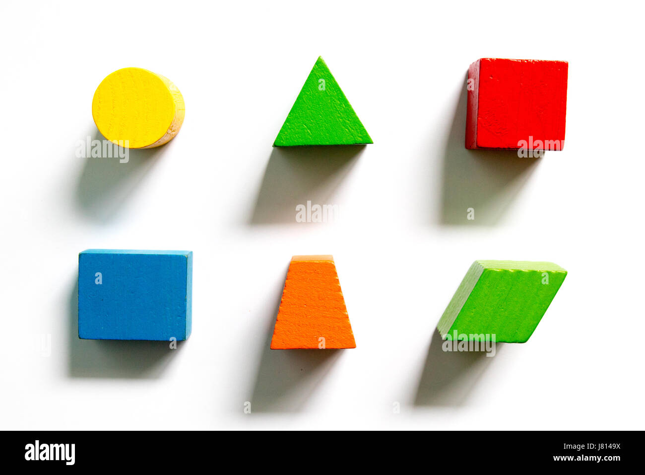 Set of colorful wooden shape toy on white background Stock Photo - Alamy