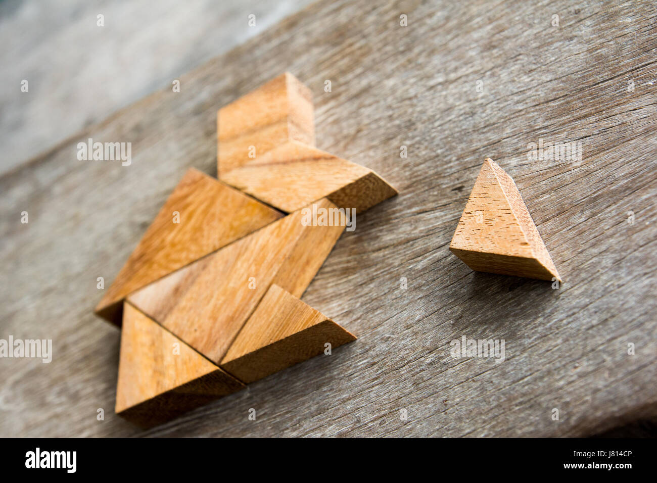 Wooden tangram puzzle wait to fulfill home shape for build dream home ...