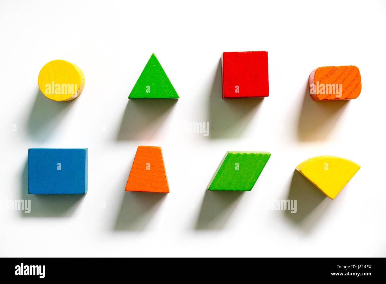 Set of colorful wooden shape toy on white background Stock Photo - Alamy