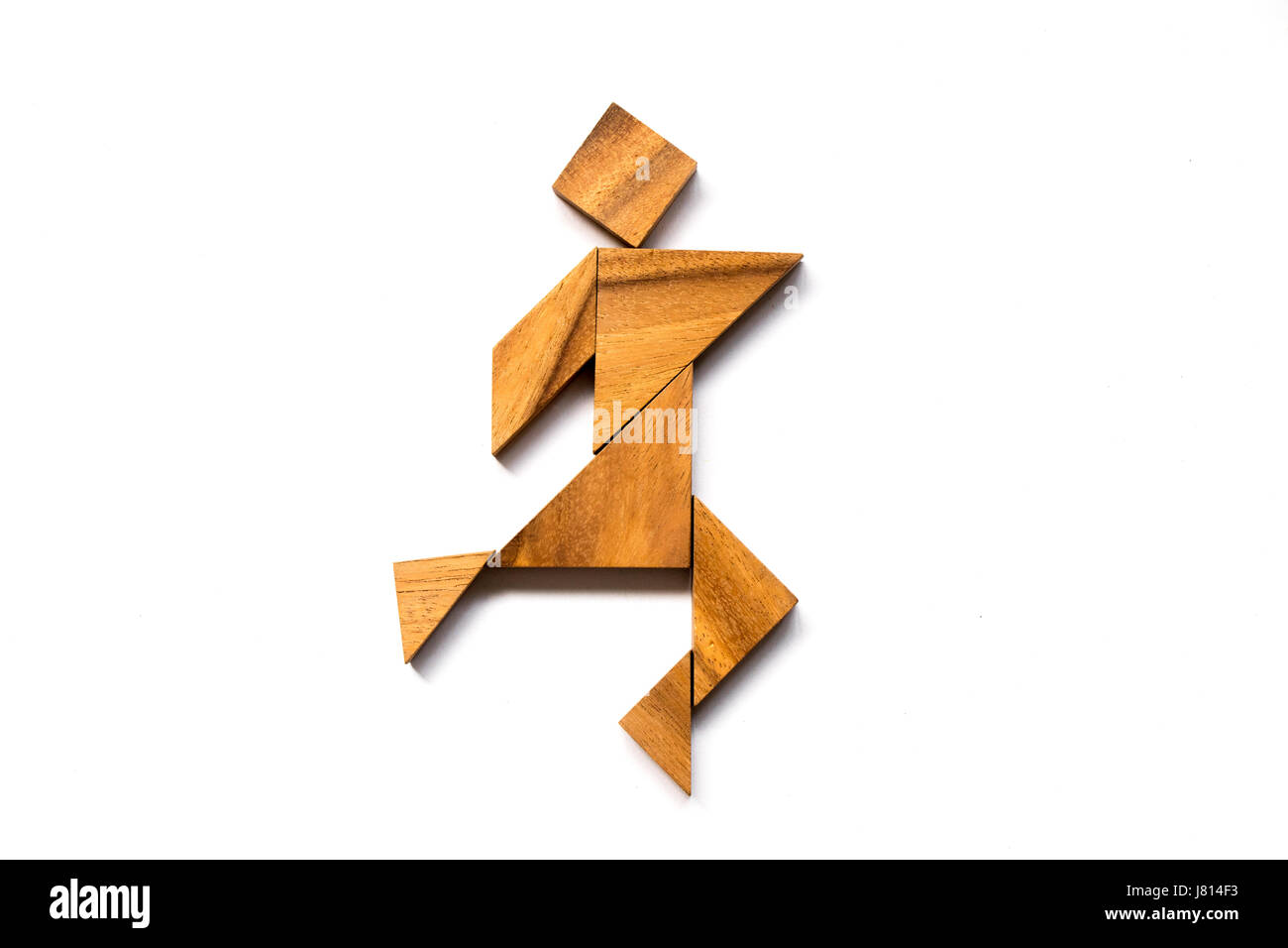 Wooden tangram as happy man shape on white background (Concept as ...