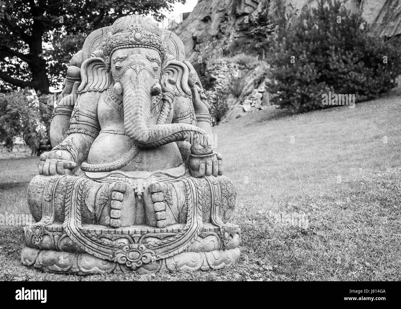 Ganesha statue, made of stone, with a beautiful mountain garden in ...