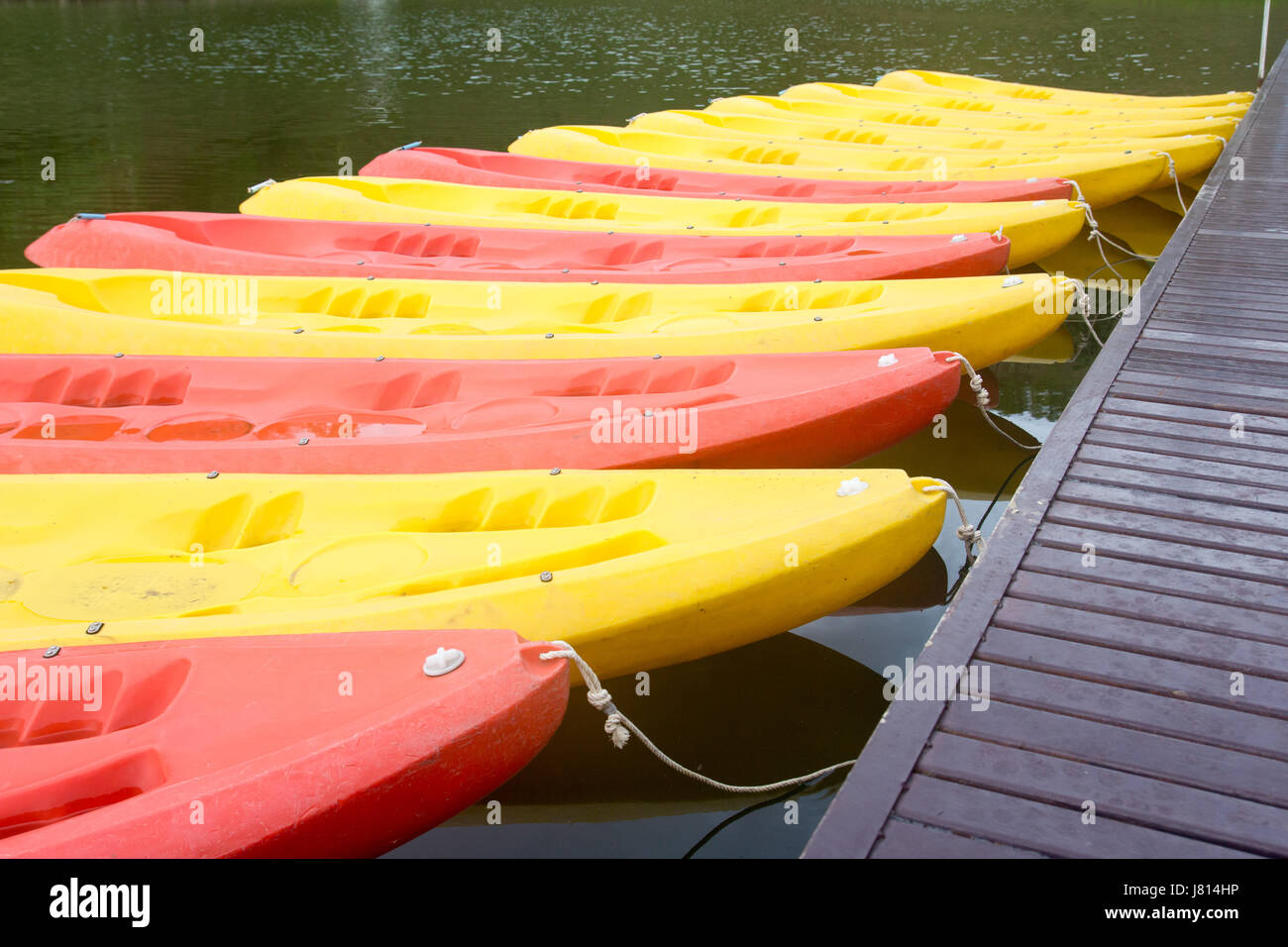 Group of red, yellow color Kayak stop at the port Stock Photo - Alamy