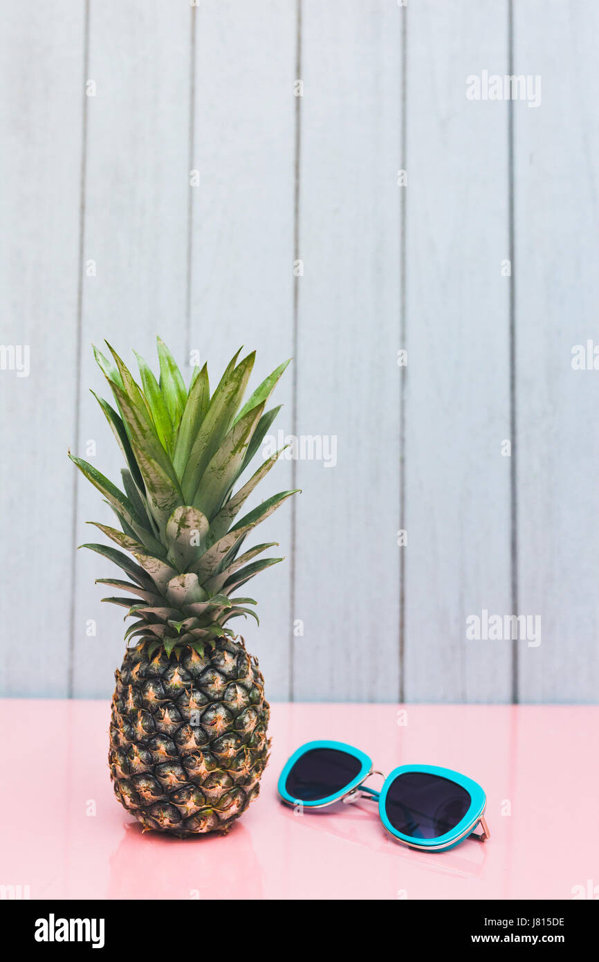 Pineapple on a blue pastel background Stock Photo - Alamy